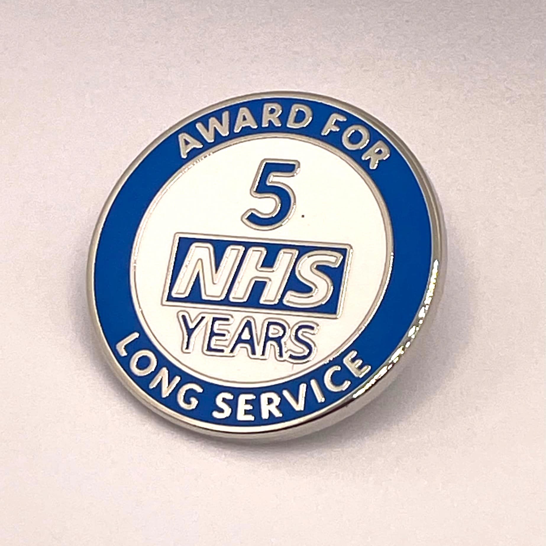 The Everyday Honour: Why Long Service Badges Outshine Traditional ...